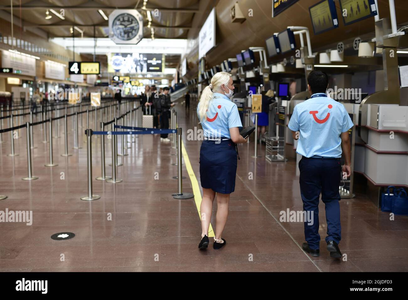 Staff getting ready to check in passengers at Arlanda airport ...