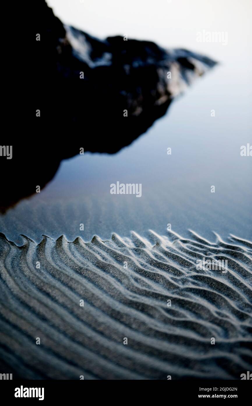 Water Wave silhouette in the sand shadowed with mountain Stock Photo ...