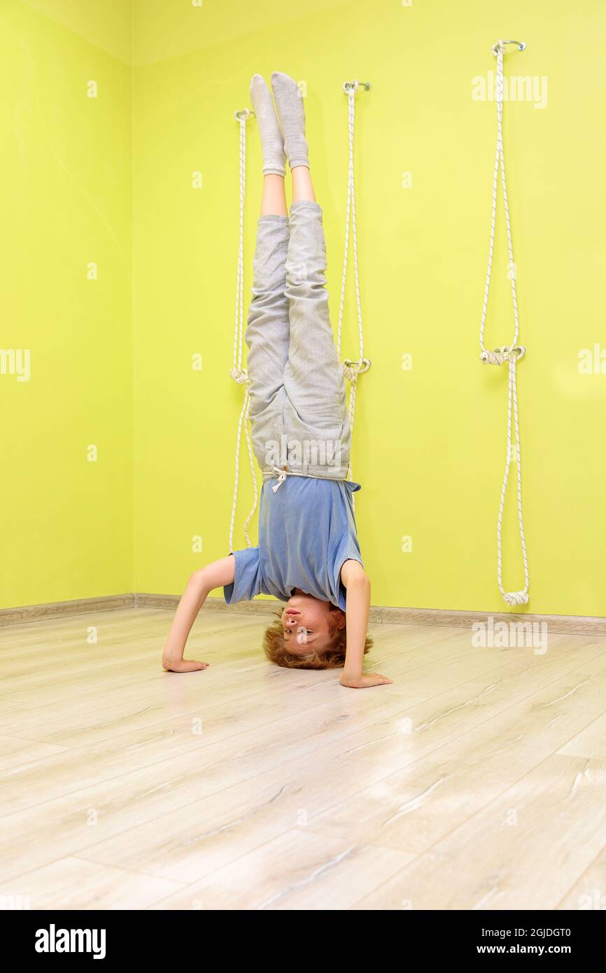 Child doing headstand hi-res stock photography and images - Alamy