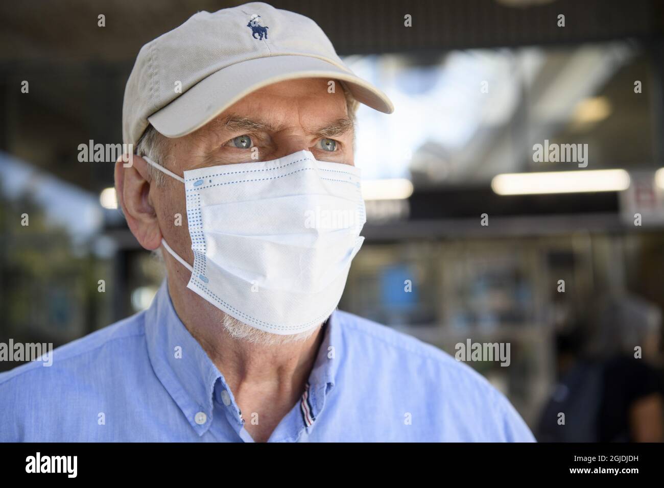 An elderly man (model) wearing personal protective equipment (PPE ...