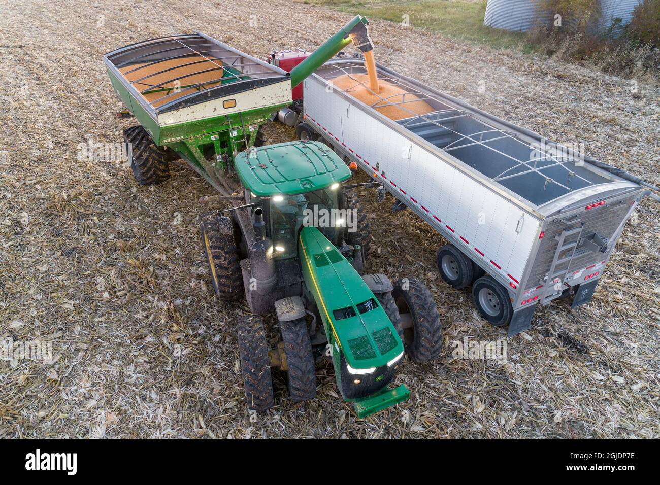 63801-14005 Aerial view of grain cart unloading corn into semi-truck ...