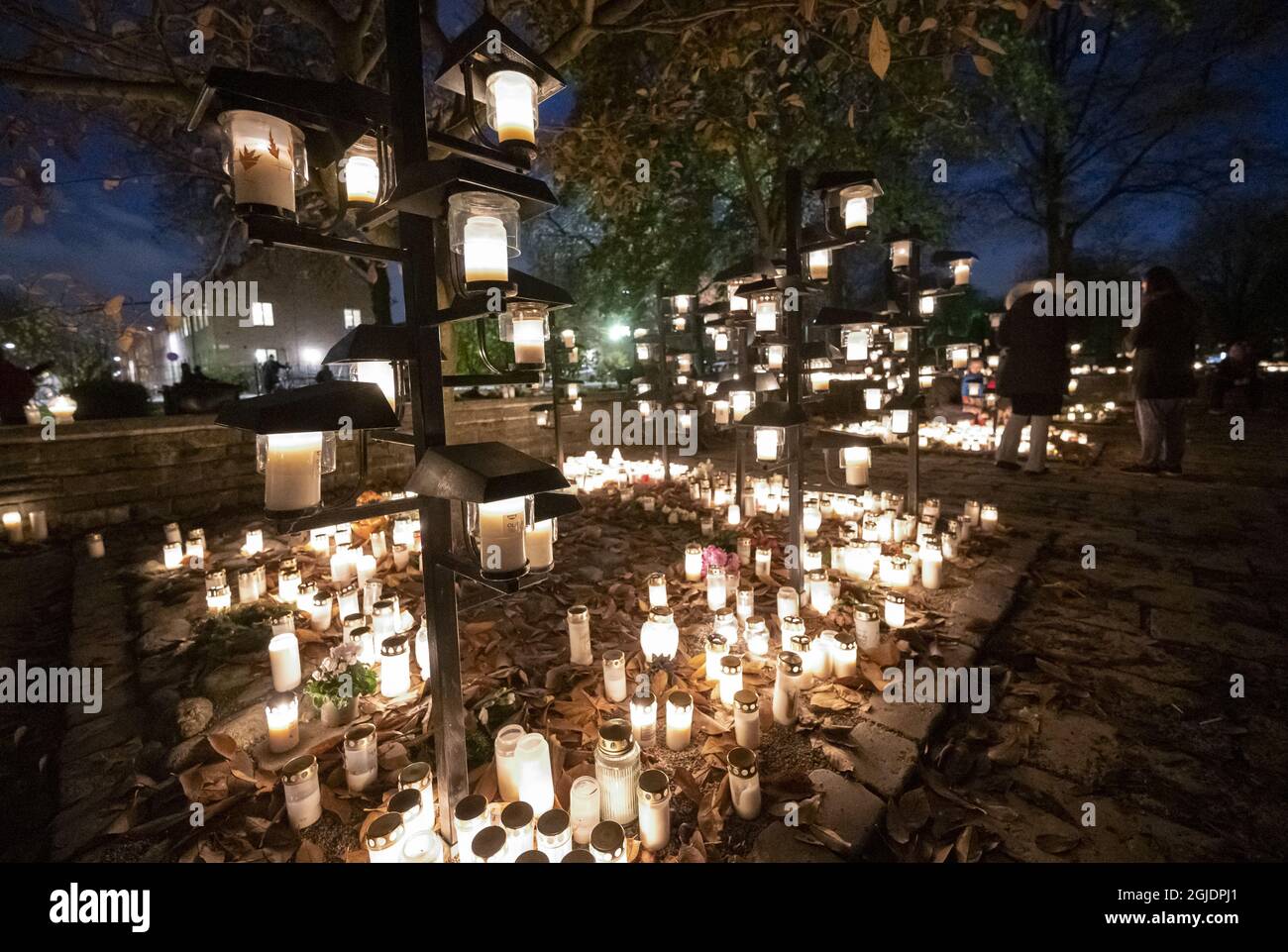 Lit candles in the memorial grove to remember loved ones at St. Pauli ...