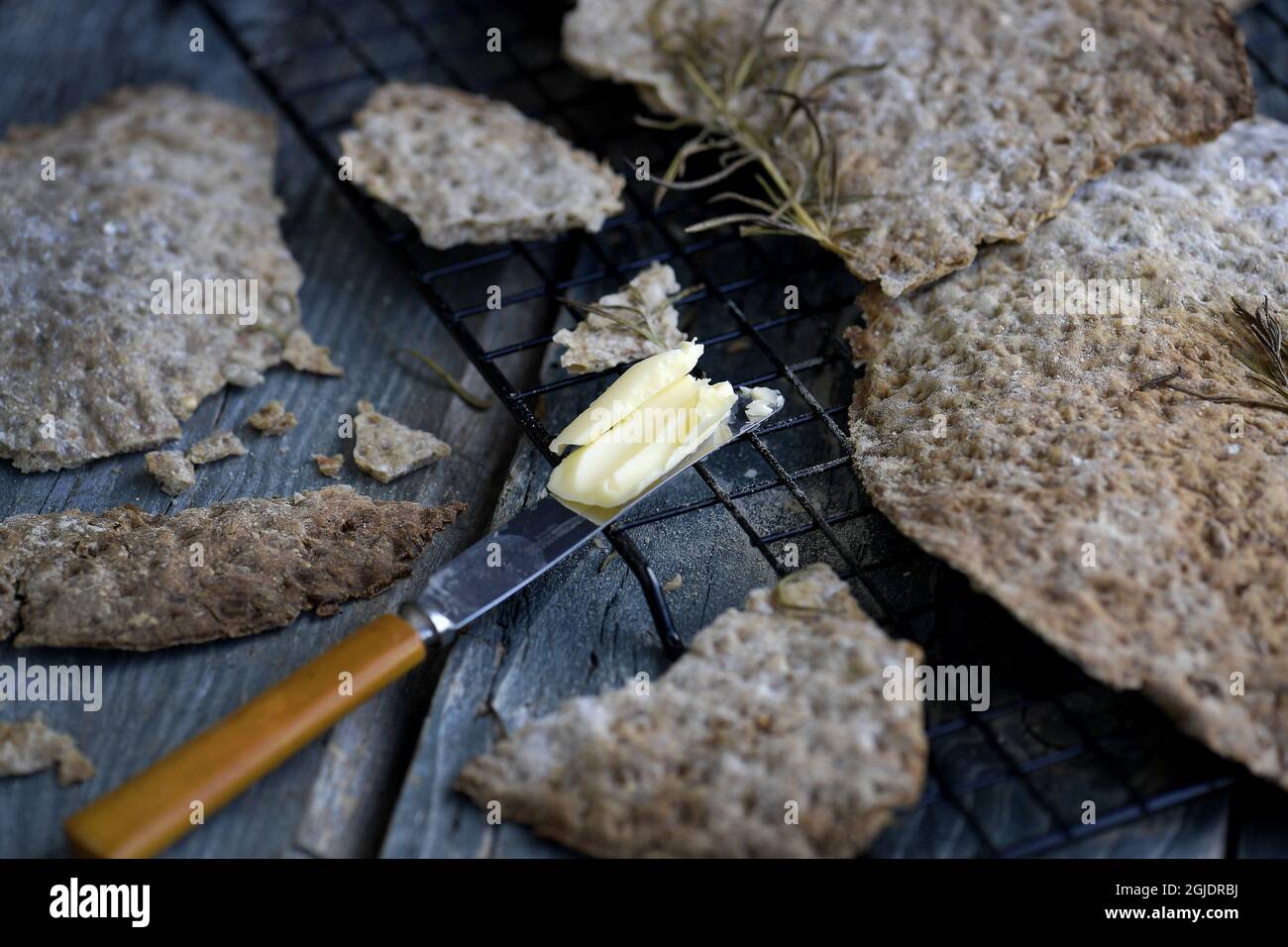 Hard bread, crisp bread with rosemary, sunflower seeds and butter Photo ...