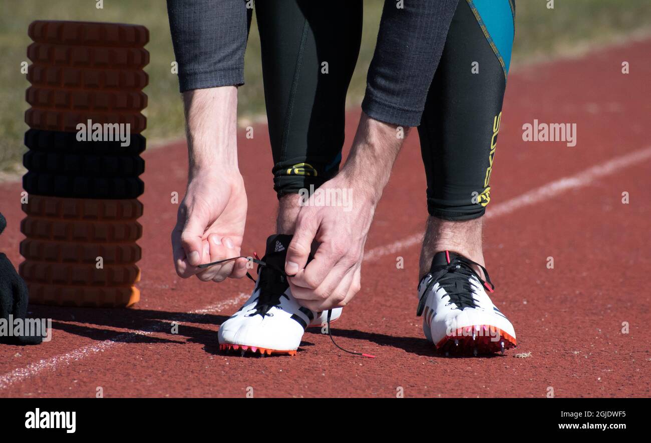 A man ties his running shoes on a running track Photo: Henrik Isaksson ...