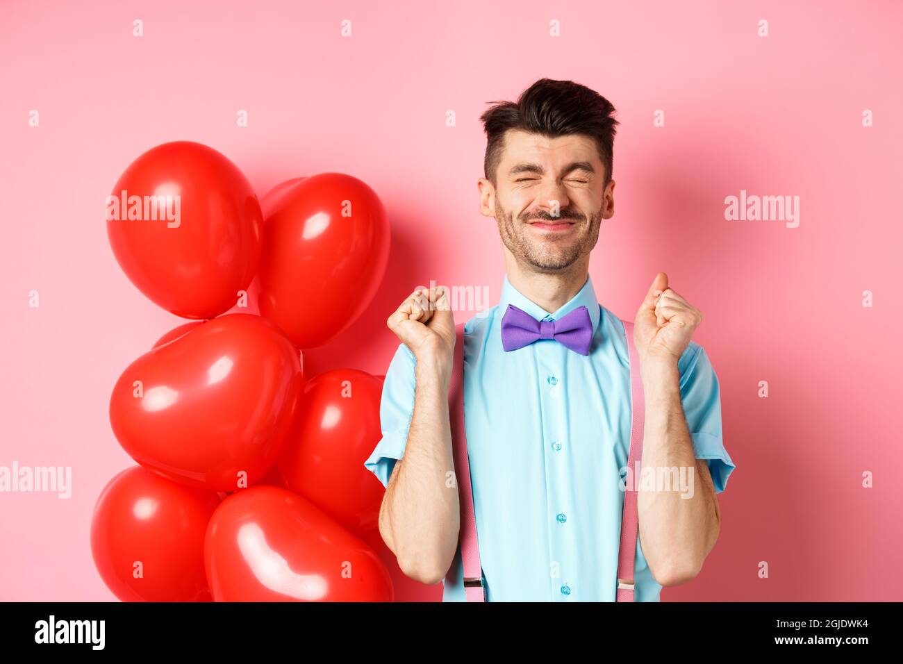 Valentines day concept. Cheerful guy jumping from excitement before ...