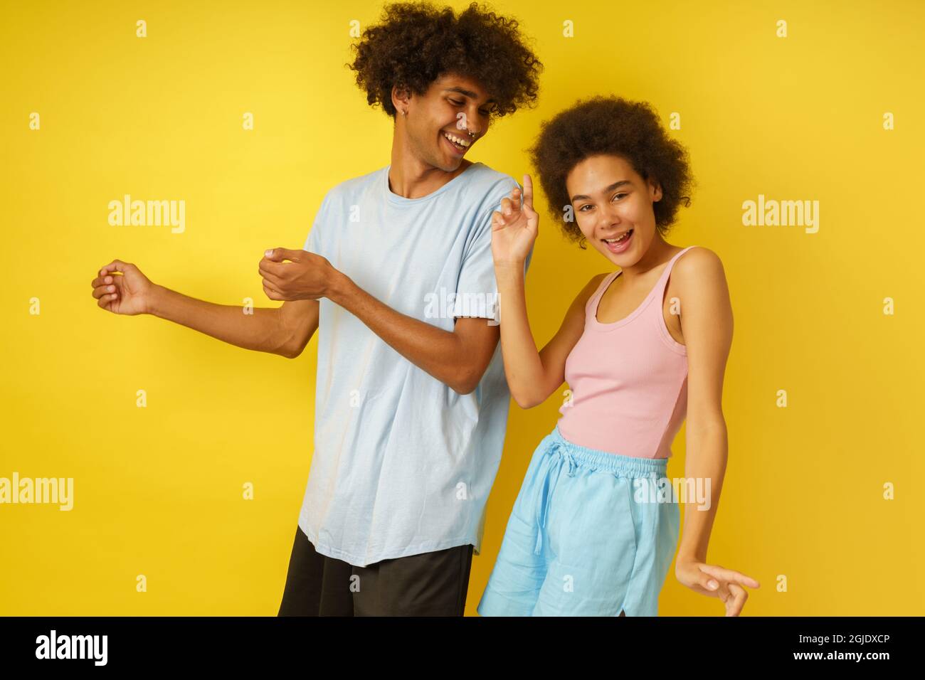 Happy and carefree boyfriend and girlfriend dance together Stock Photo ...