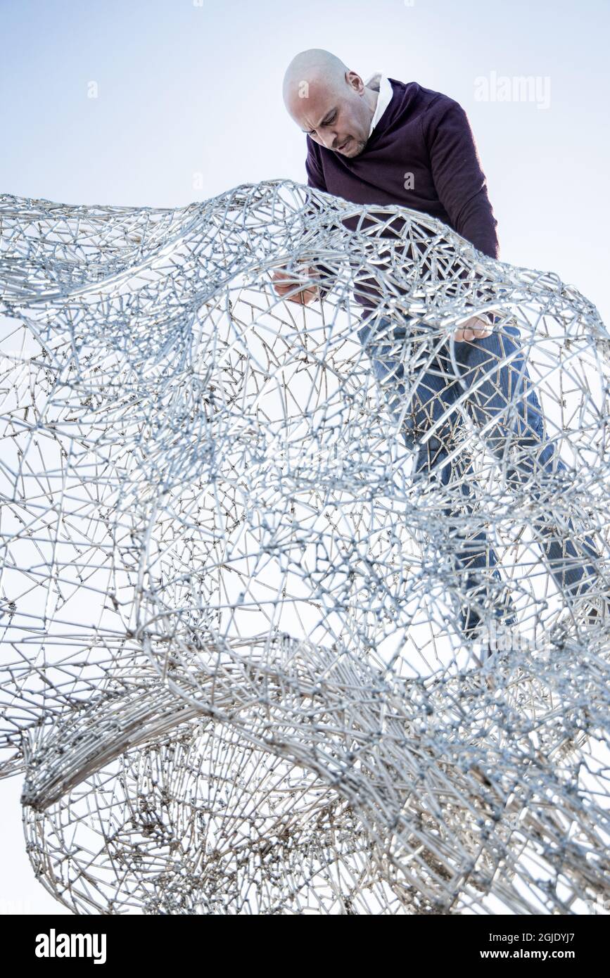 The Syrian-born artist Mohannad Soleman is putting the finishing ...