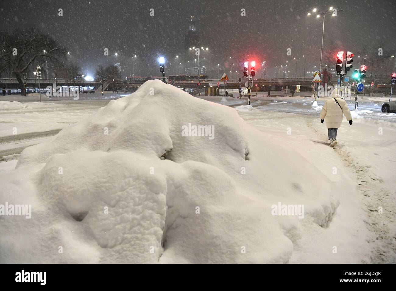 People walking in the heavy snowfall in central Stockholm, Sweden, on ...