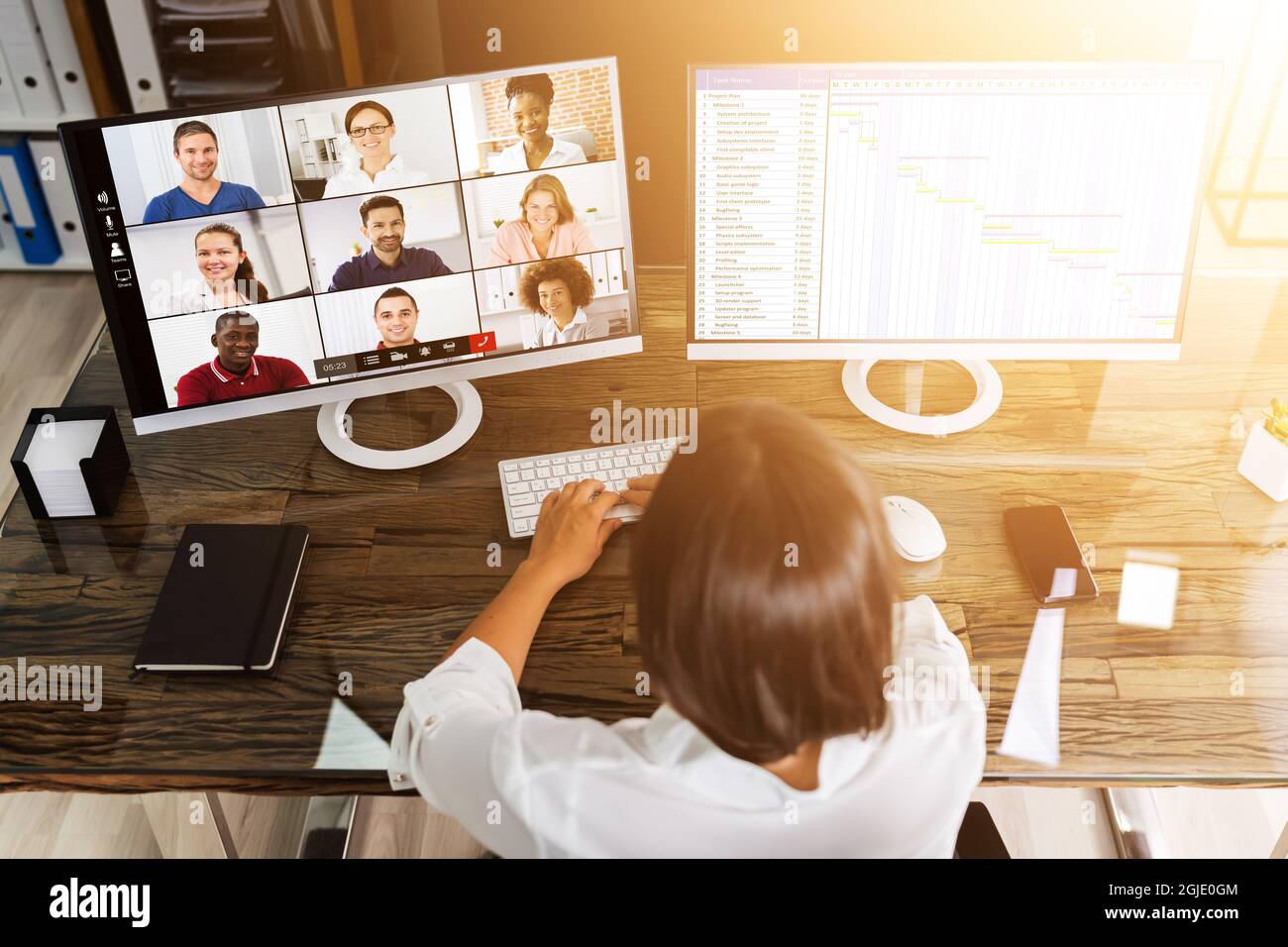 Virtual Conference With Agenda On Multiple Monitor Computer In Office ...