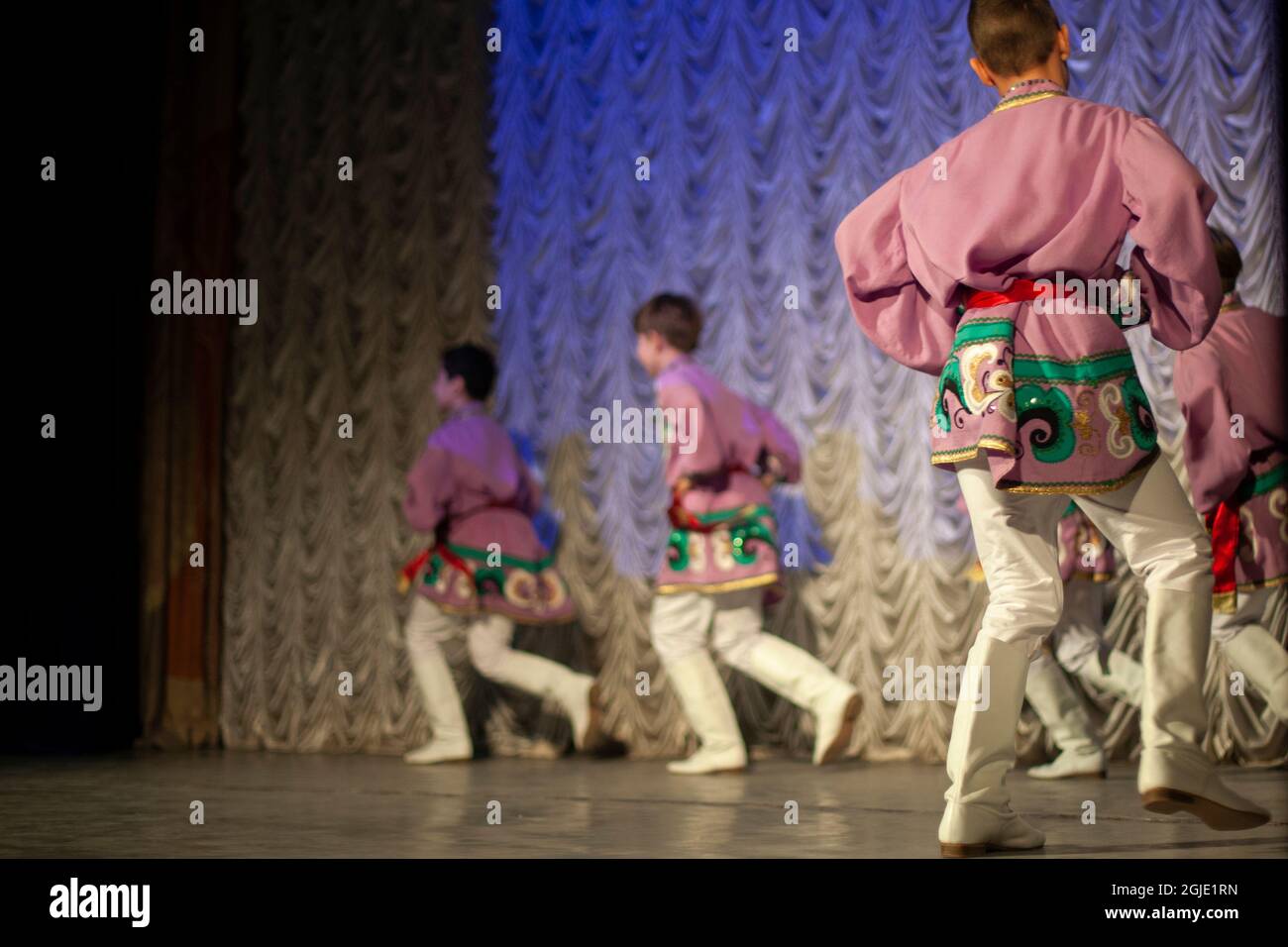 They dance in folk costumes. Russian children dance in sarafans ...