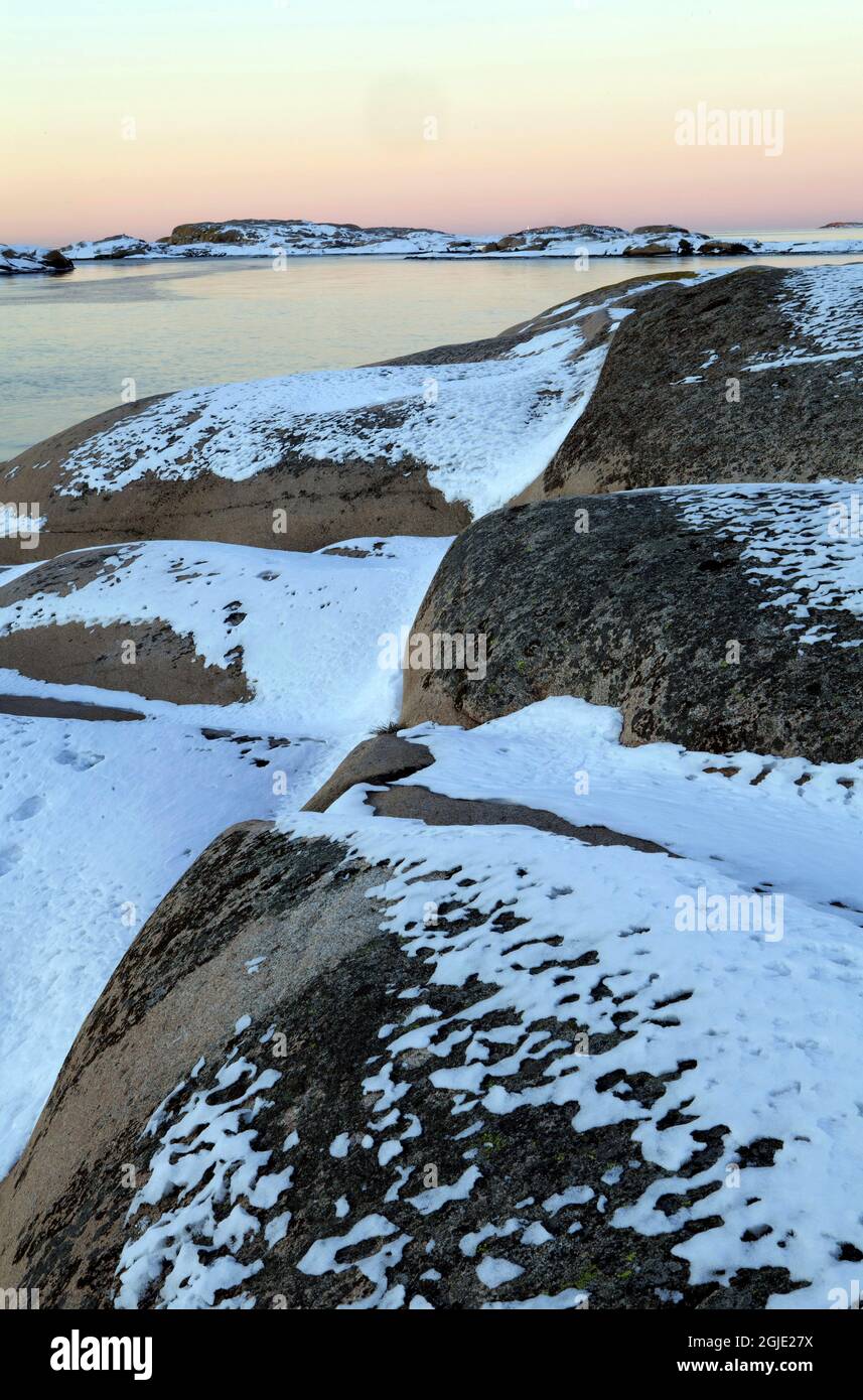 Granite rock formations covered in snow at Fykan in Ramsvikslandet's ...
