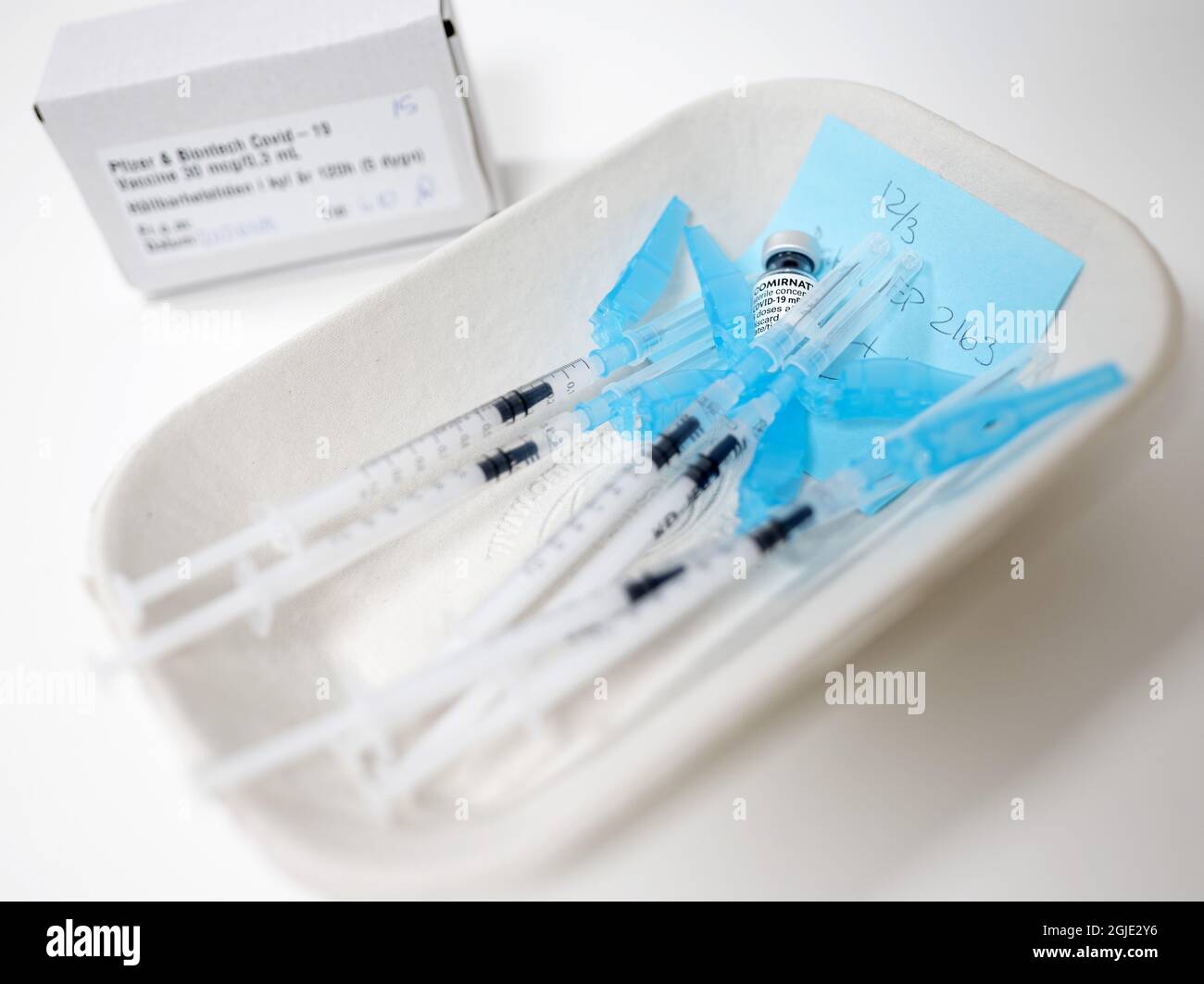 Used and discarded syringes with Comirnaty Covid-19 vaccine made by ...