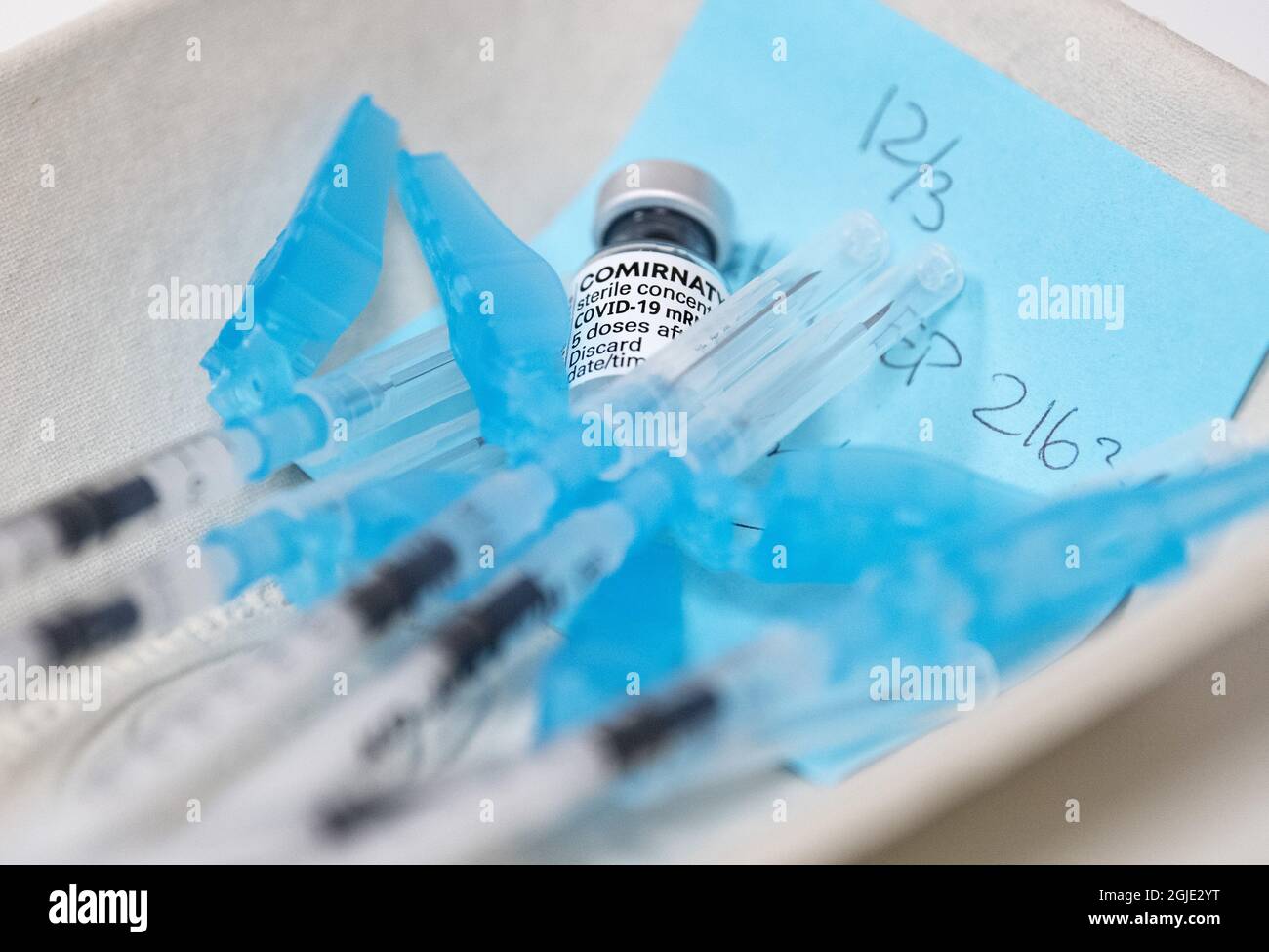 Used and discarded syringes with Comirnaty Covid-19 vaccine made by ...