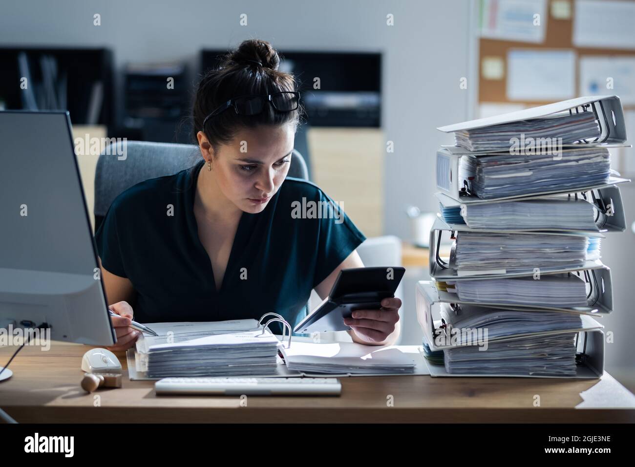 Workaholic Working On Desktop Computer At Night Stock Photo - Alamy