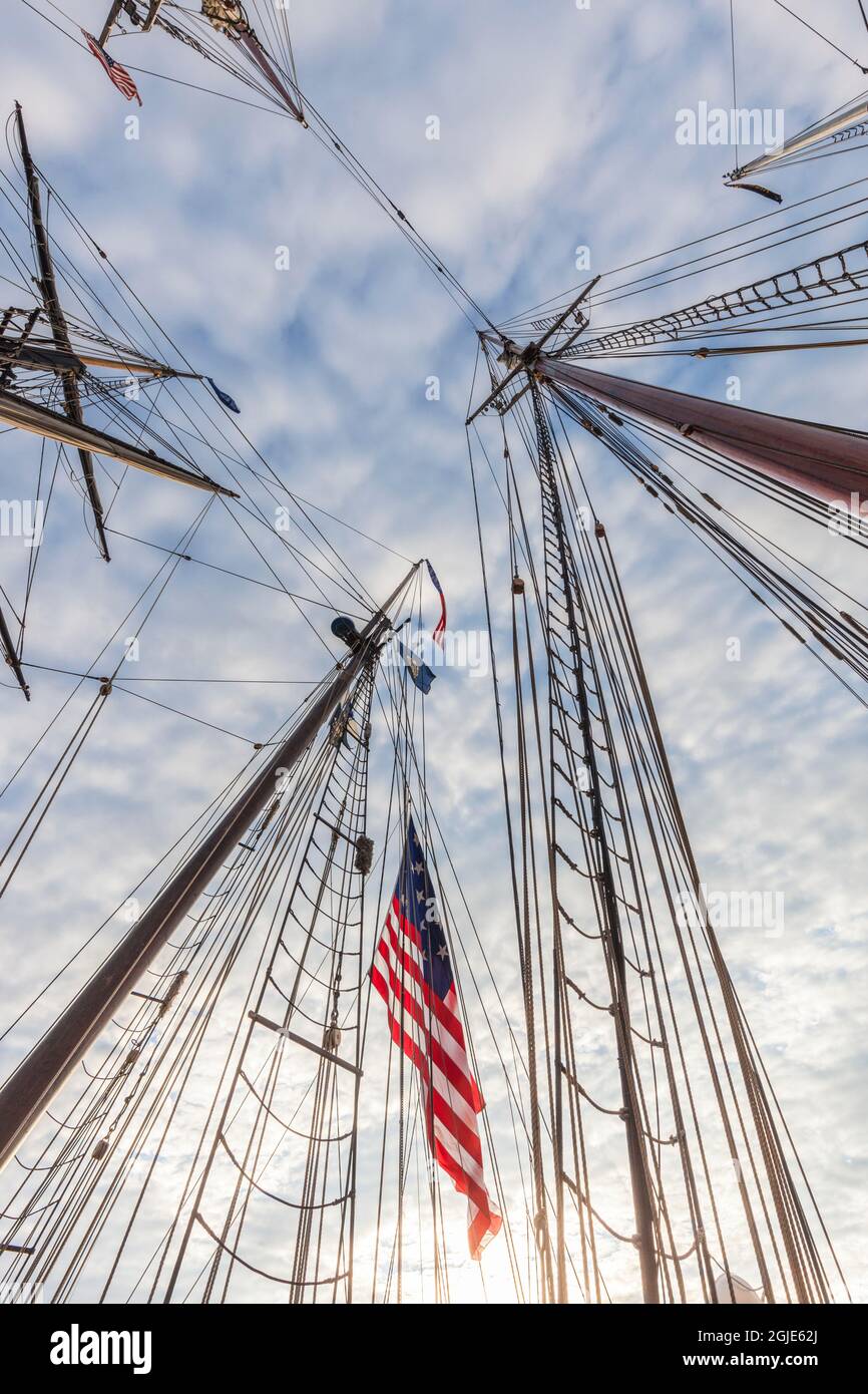 USA, Massachusetts, Cape Ann, Gloucester. Gloucester Schooner Festival, schooner masts and US ...