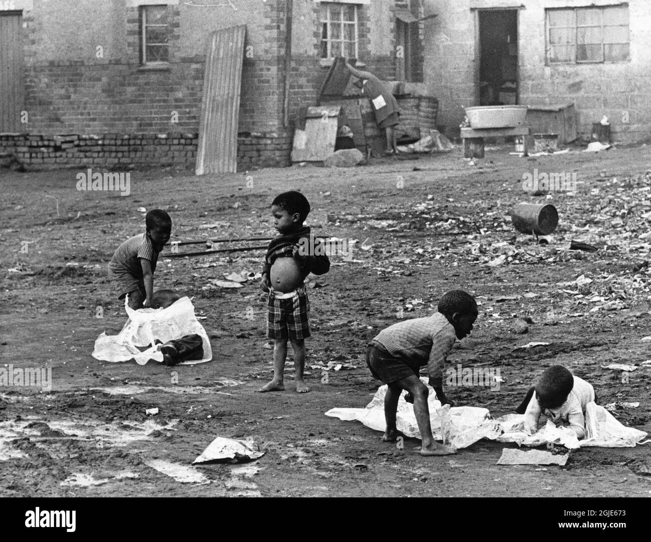 Children playing in the street. The destruction after last year's riots ...