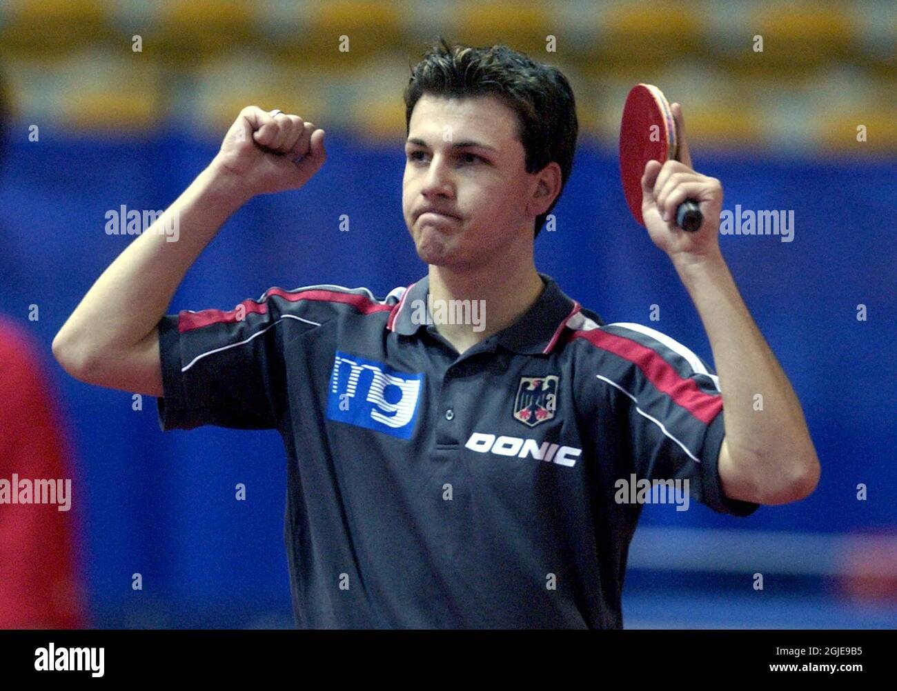 Germany's Timo Boll celebrates after beating Denmark's Michael Maze ...