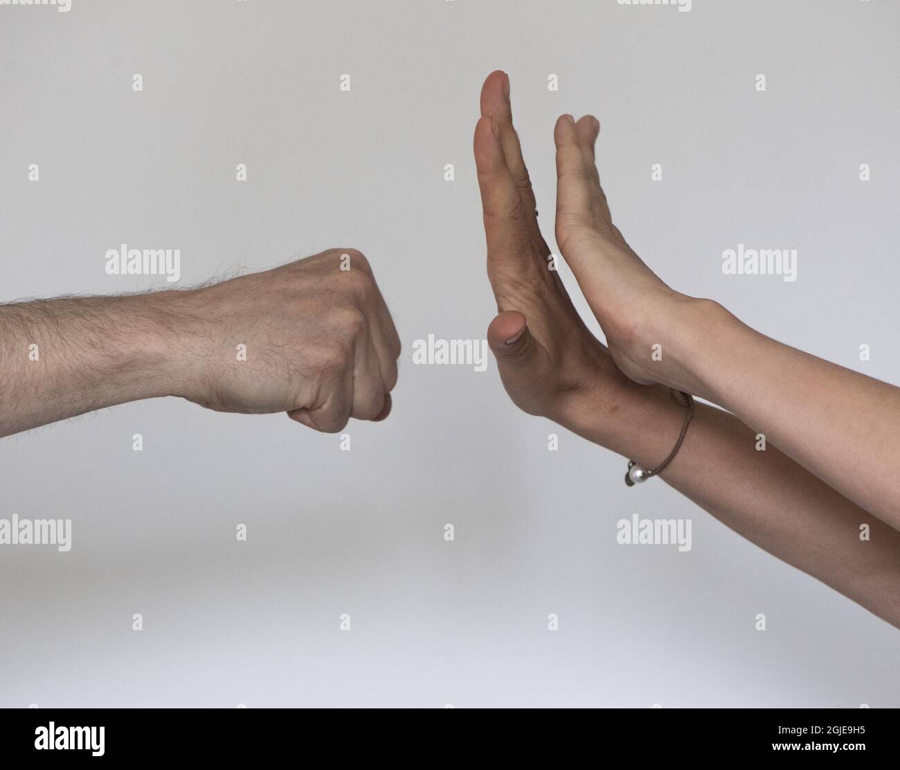 Domestic violence. Aggressive man with clenched fist threatening to hit ...