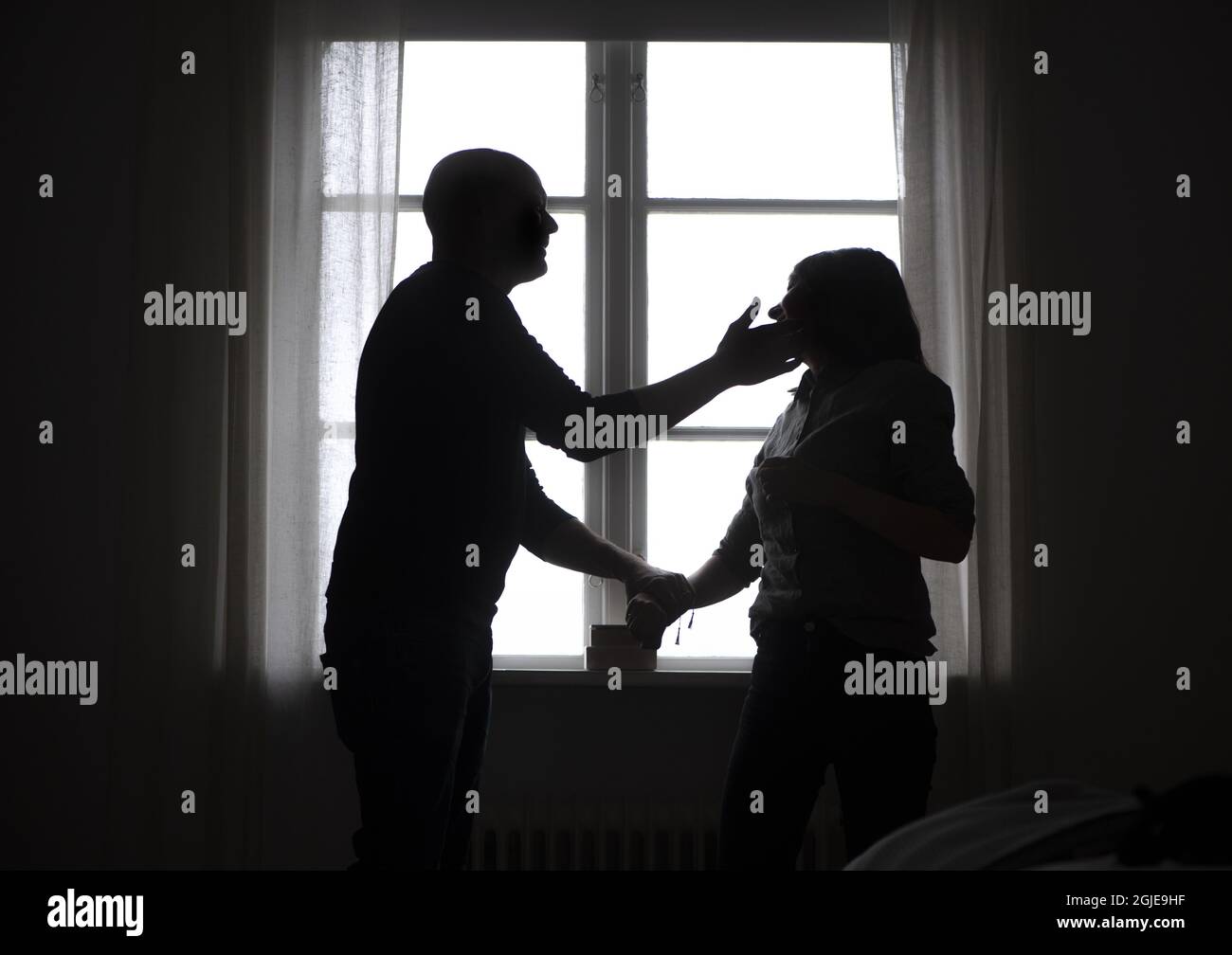 Domestic violence. An Aggressive man hitting, slapping a woman in the ...