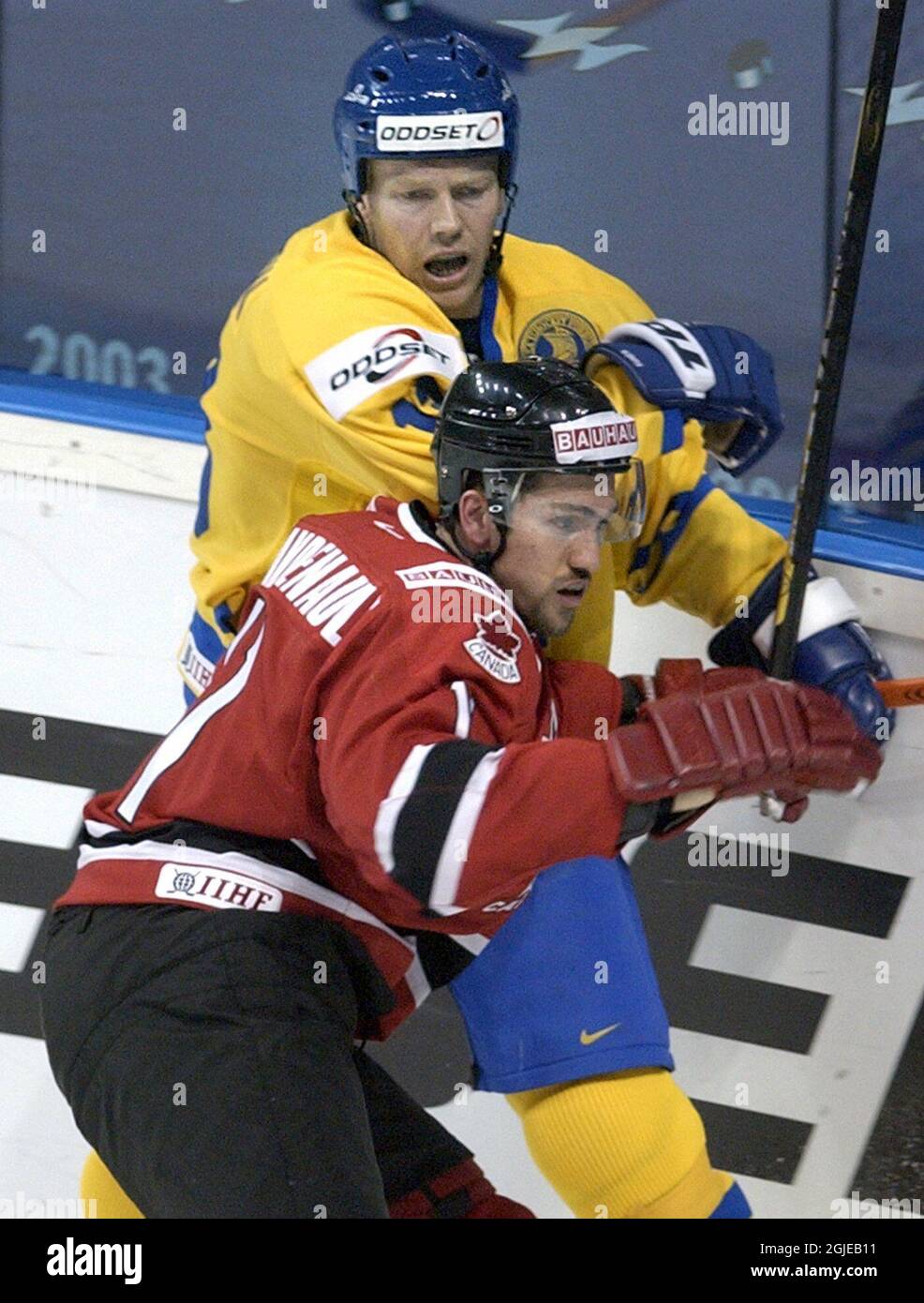 Sweden's Mats Sundin (back) and Canada's Mathieu Dendanult (front ...