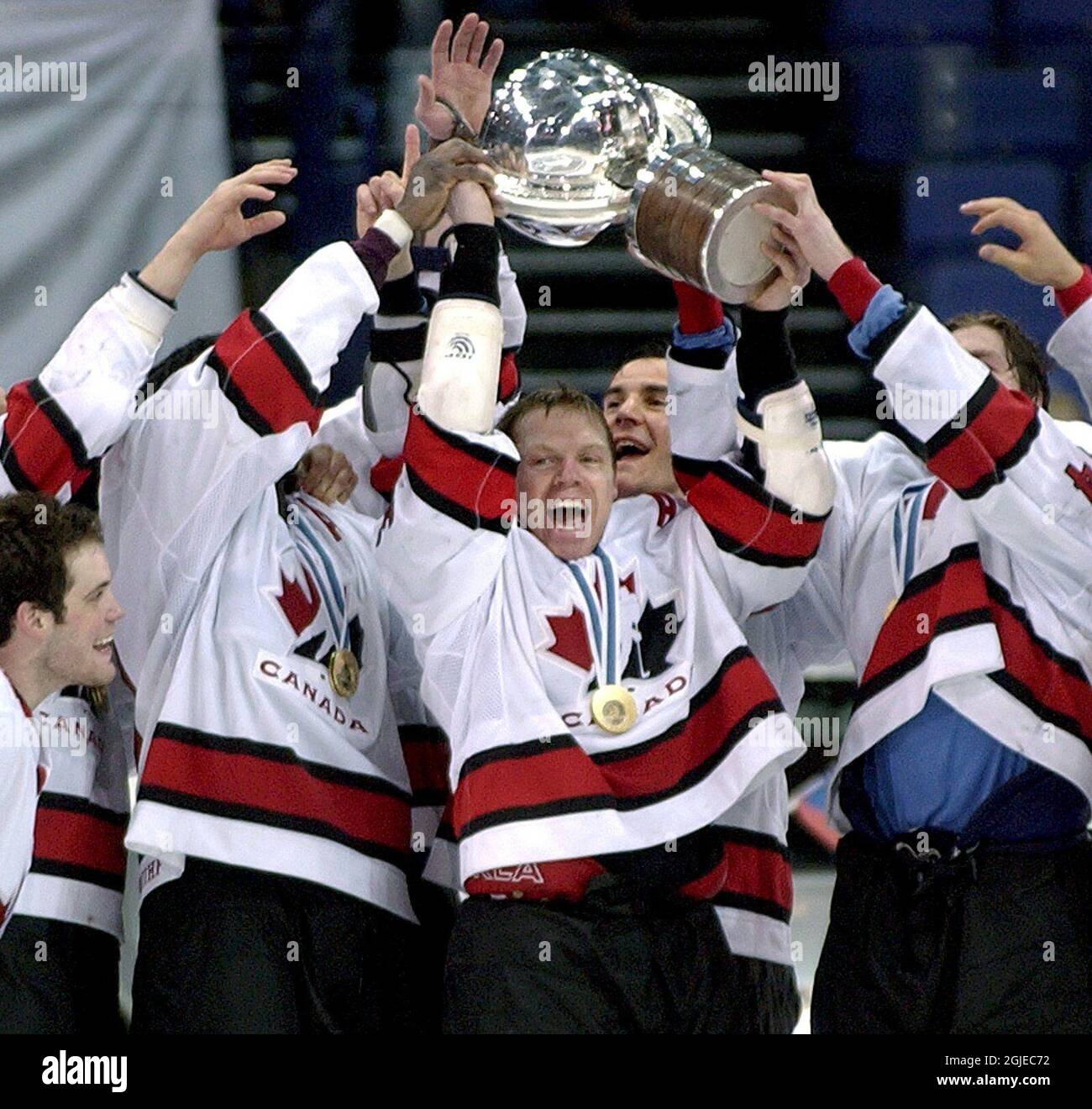 Canada's Kris Draper raises the trophy following his teams victory ...