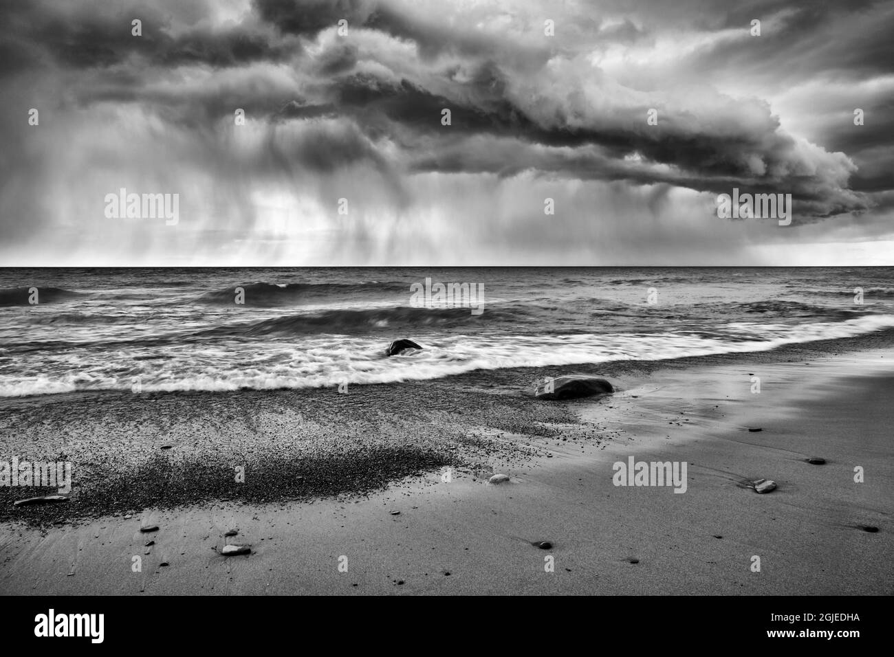 USA, Michigan, Upper Peninsula, Rain cloud over Pictured Rocks National ...