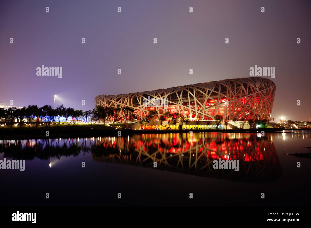 A Olympic flag with the motto "One world One Dream" wave in the font of ...