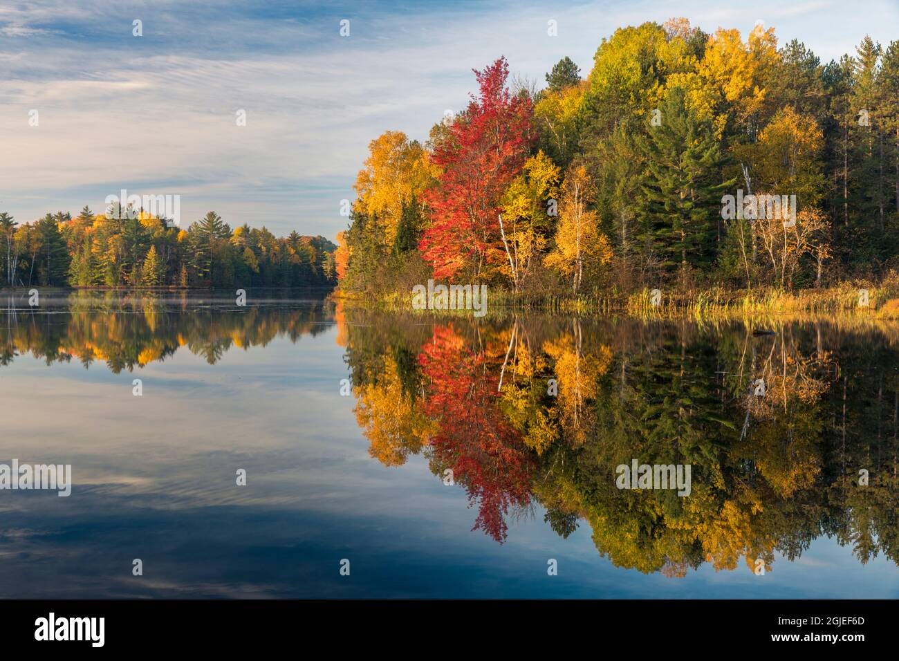 Autumn sunrise reflection on mirrored lake, Upper Peninsula of Michigan Stock Photo - Alamy