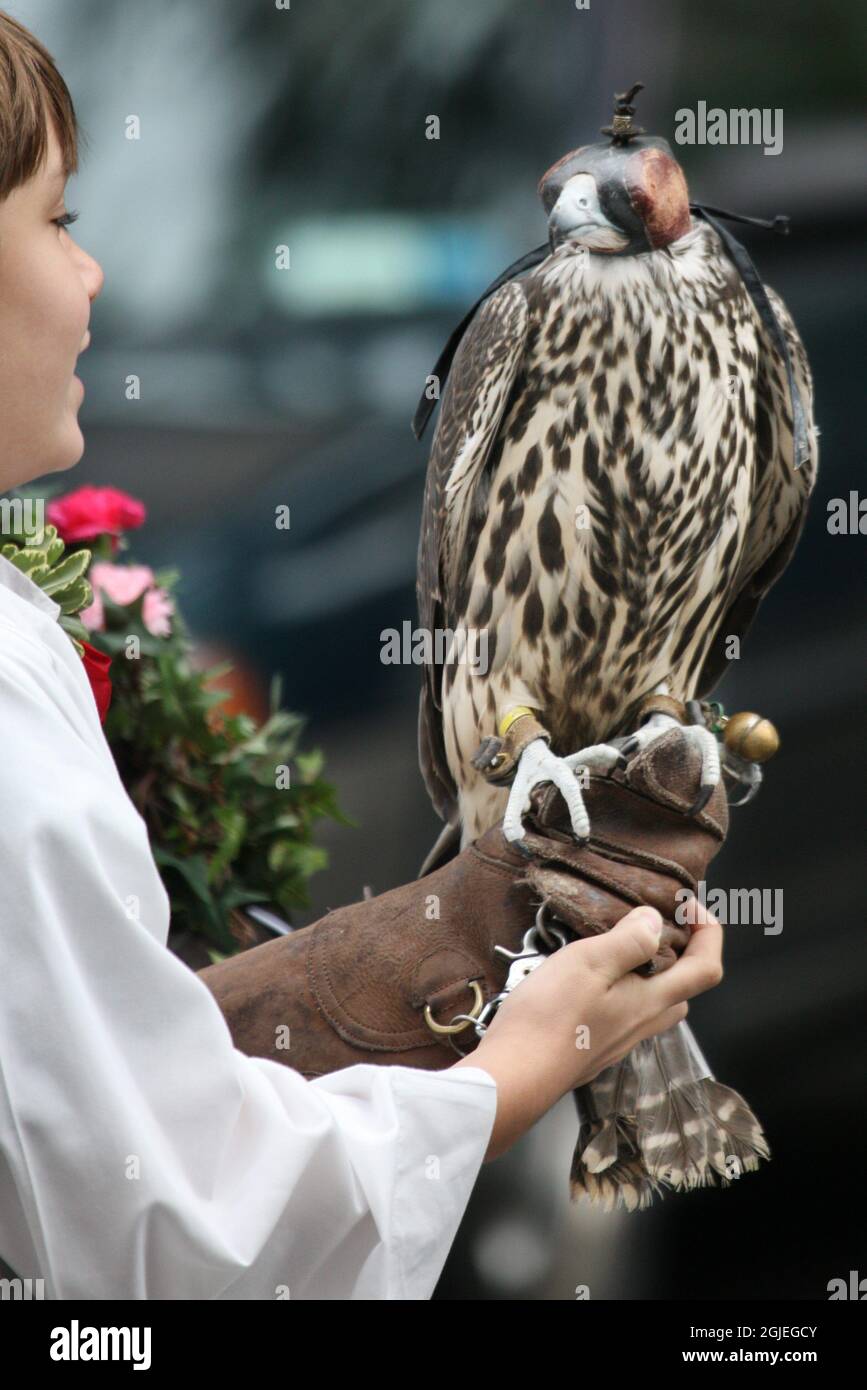 A girl with her falcon outside St Johns Cathedral in New York. The ...