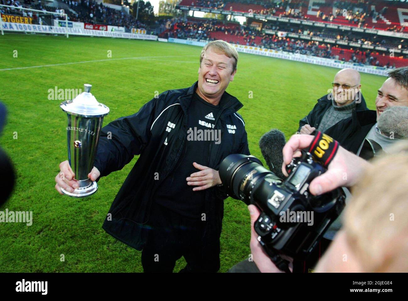 Rosenborg coach Age Hareide holding the Norwegian Championship trophy ...