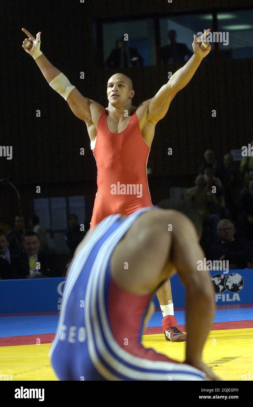 Egypt's Karam Gaber (far) celebrates beating Georgia's Ramaz Nozadze ...