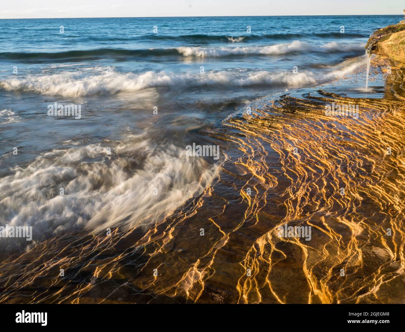 US, Michigan, Upper Peninsula. Waterfall and sandstone rock, Pictured ...