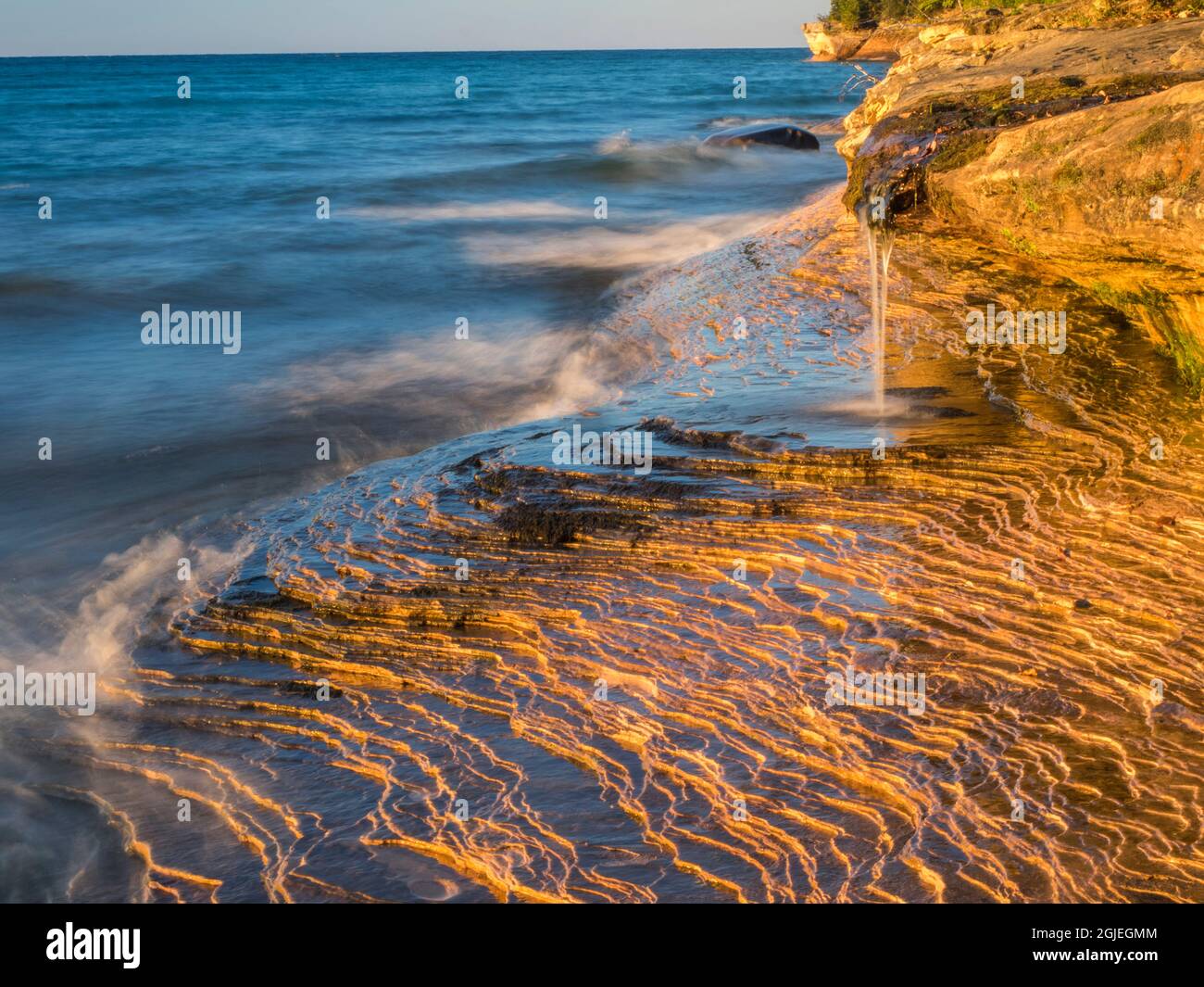 US, Michigan, Upper Peninsula. Waterfall and sandstone rock, Pictured ...