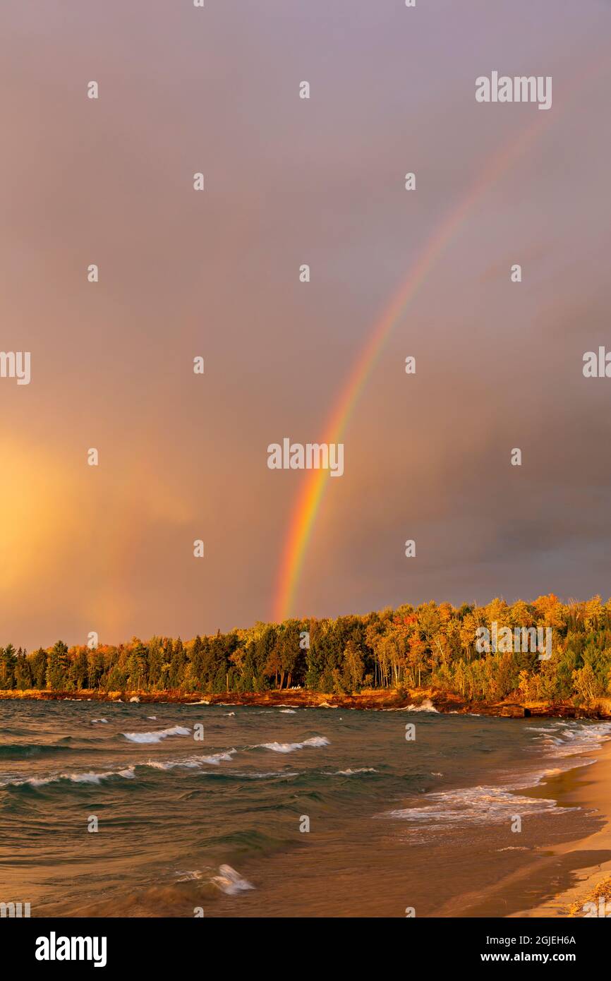 Lake Michigan shore at sunset and rainbow, Alger County, Michigan Stock ...