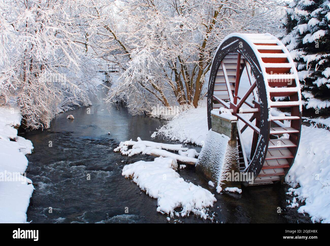 Waterwheel of small stream in winter Stock Photo - Alamy