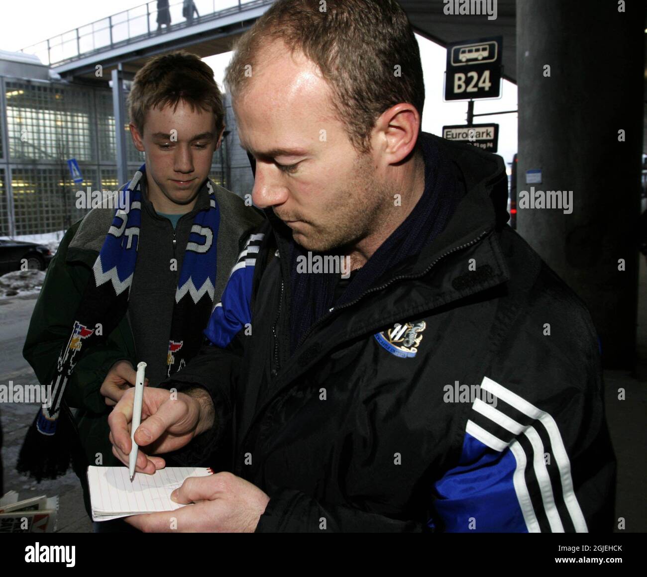 Newcastle's Alan Shearer signs an autograph for a fan upon his and his ...