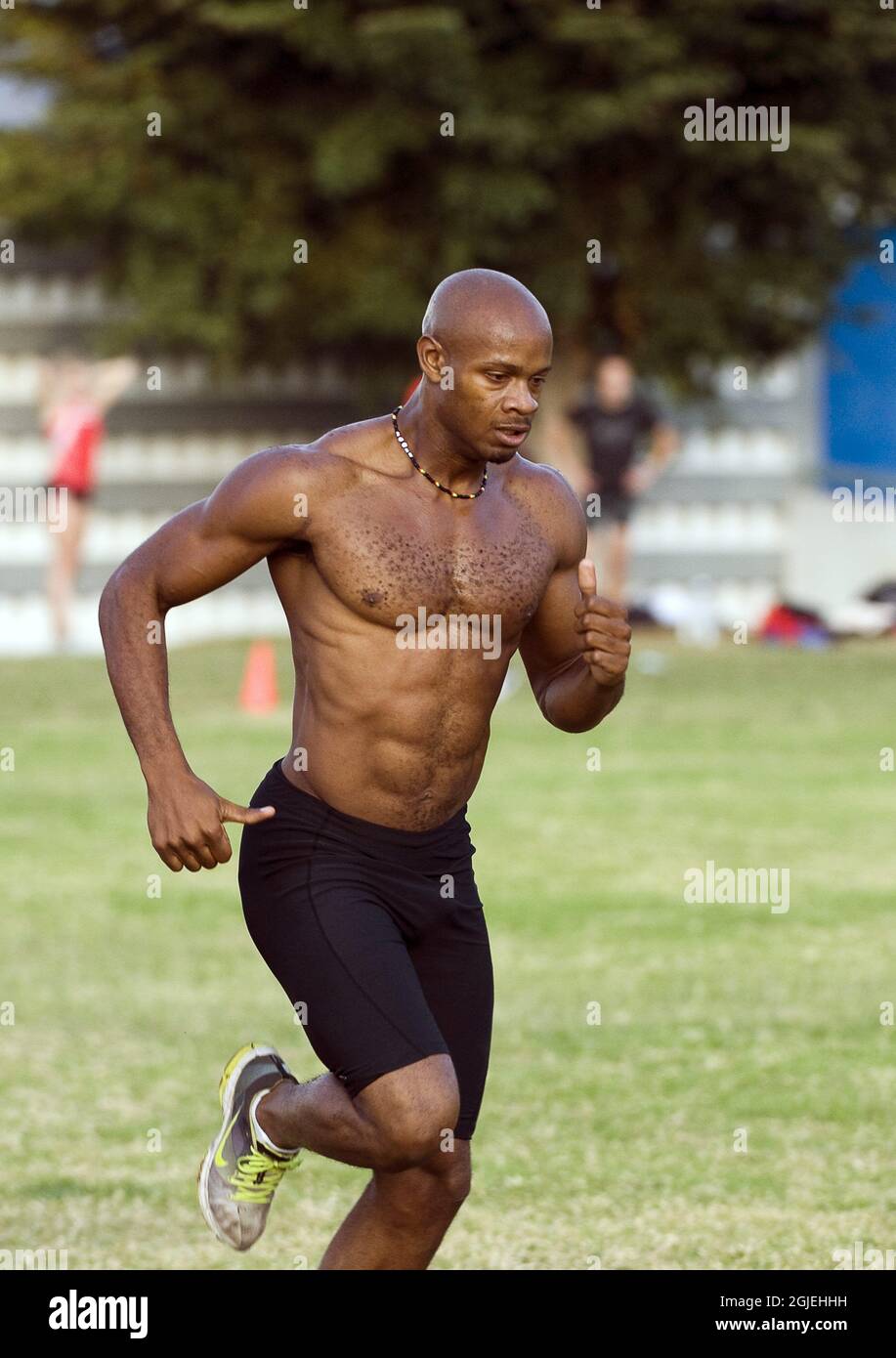 Sprinter Asafa Powell is seen during pre season training at the University of Technology stadium ...