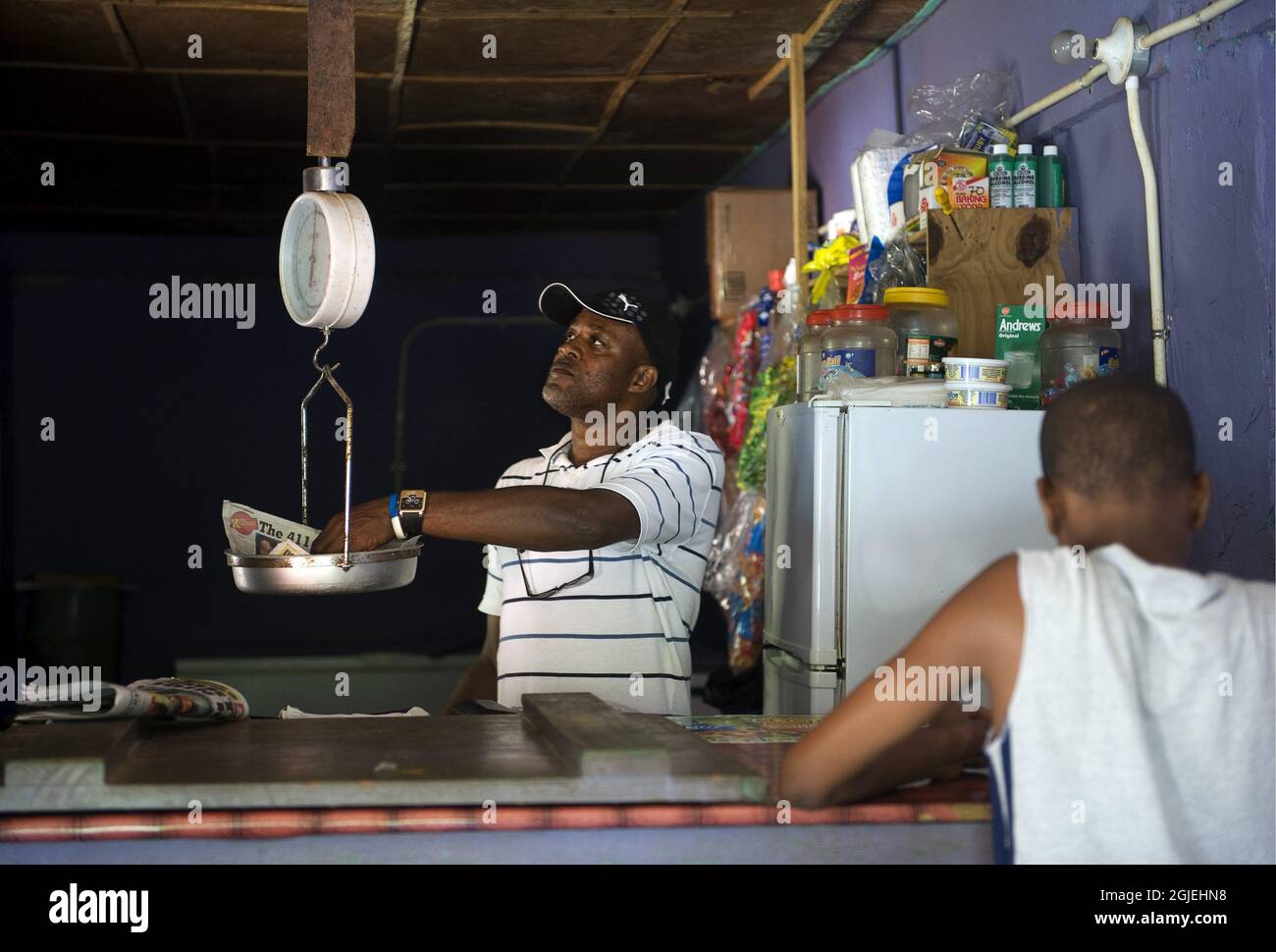 Usain Bolt's father Wellesley Bolt in his shop the village of Sherwood ...