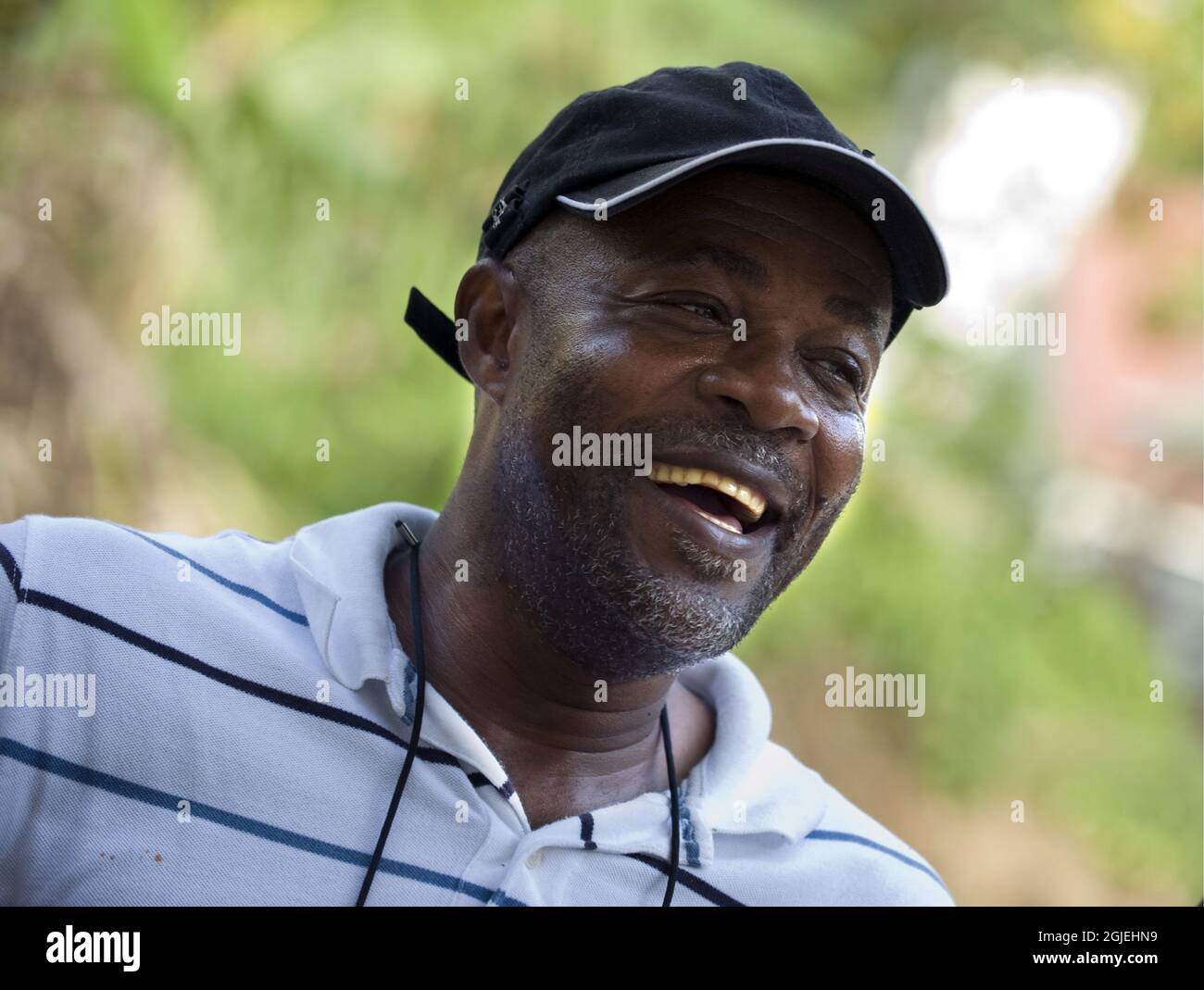 Usain Bolt's father Wellesley Bolt in the village of Sherwood Content ...