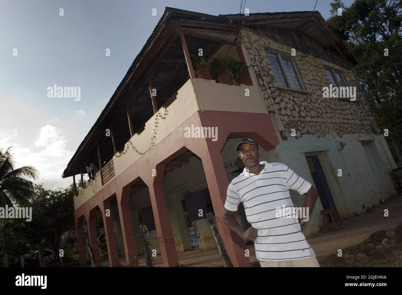 Usain Bolts father Wellesley Bolt in front of his his shop in the ...