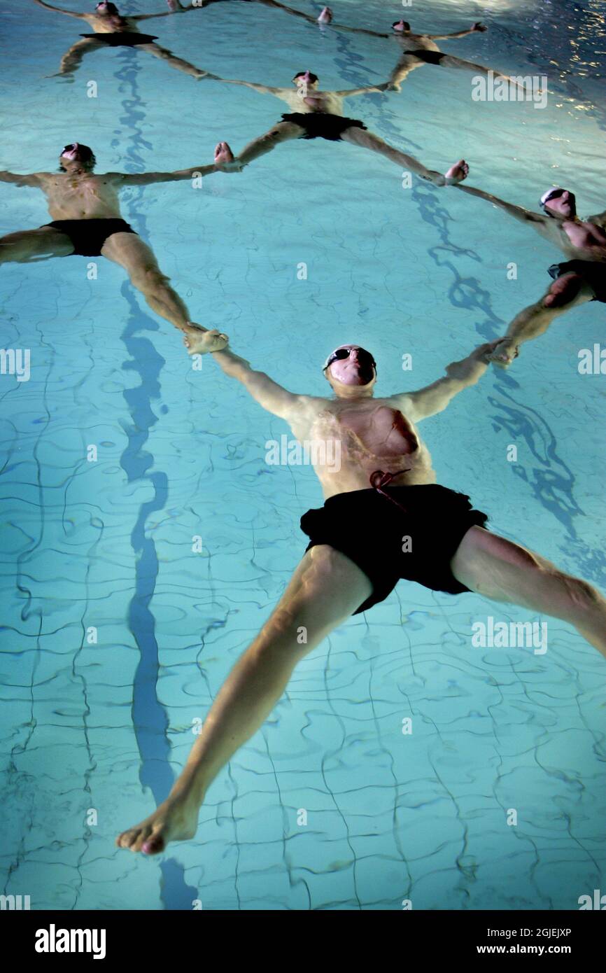 The Swedish men's synchronized swimming team in action during training ...