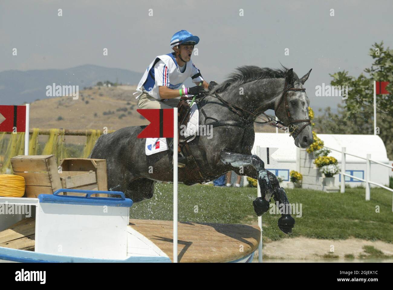 France's Nicolas Touzaint in action onboard Galan De Sauvagere Stock ...