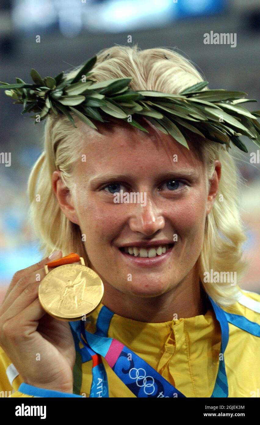 Sweden's Carolina Kluft proudly holding her gold medal Stock Photo - Alamy