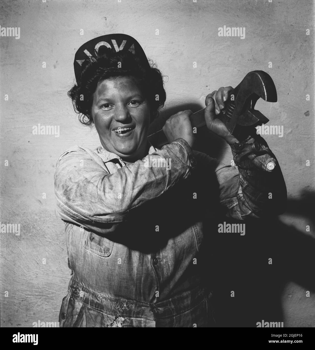Marta Back holding a huge wrench at the garage, a utensil she say's she ...