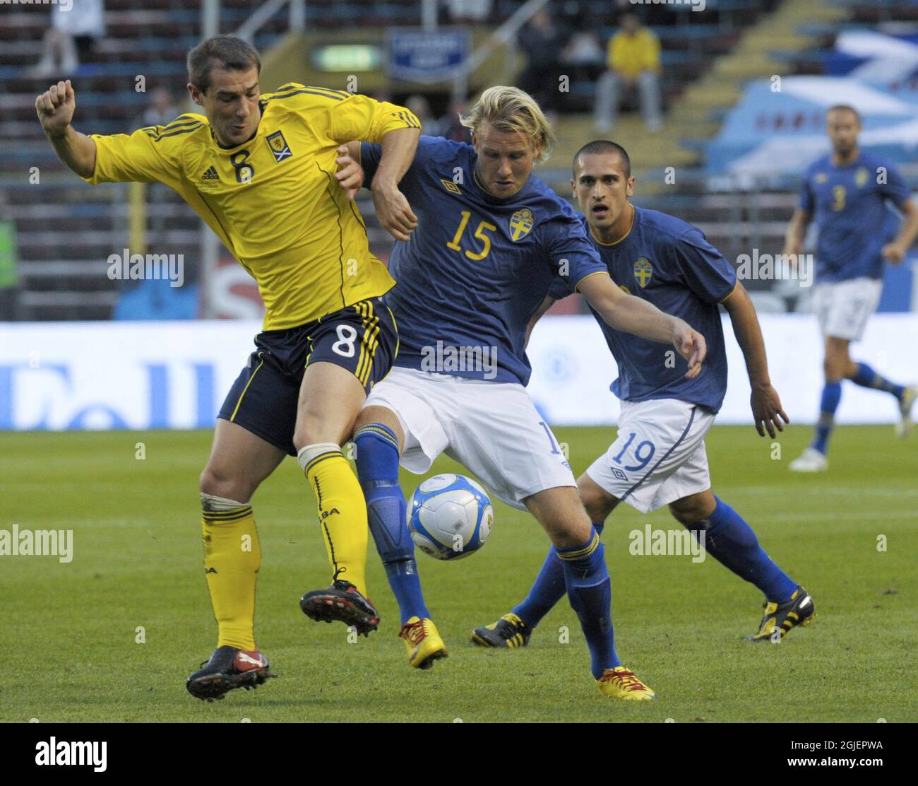 Swedens Ola Toivonen, left, vies Scotland's Kevin Thomson during a ...