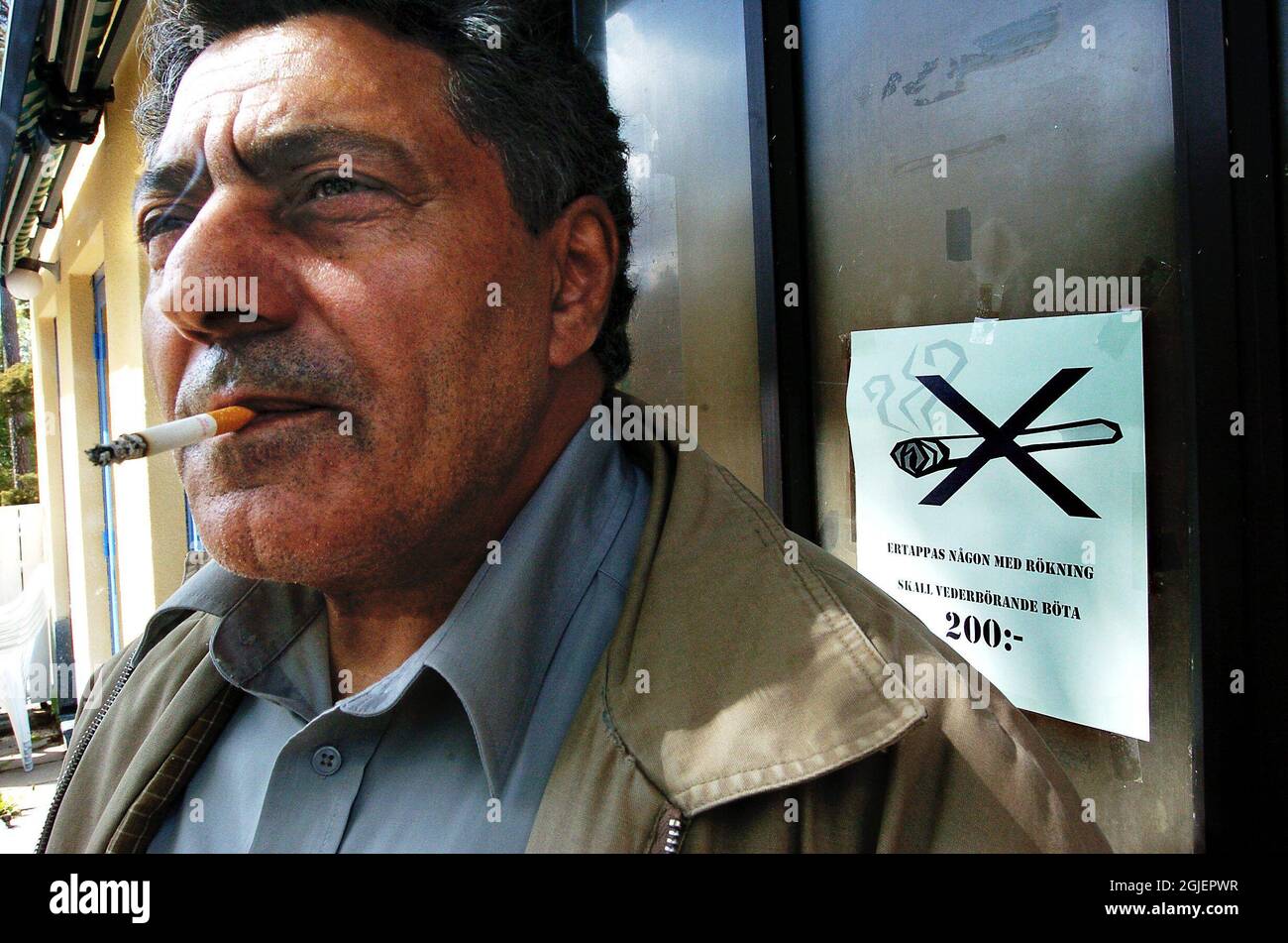 Hacia Baysal smoking a cigarette outside the now non-smoking restaurant ...