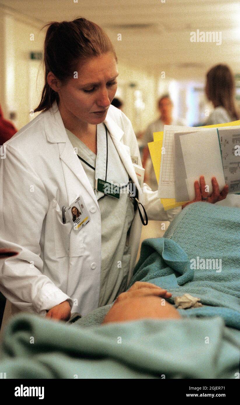 A doctor examining a patient Stock Photo - Alamy
