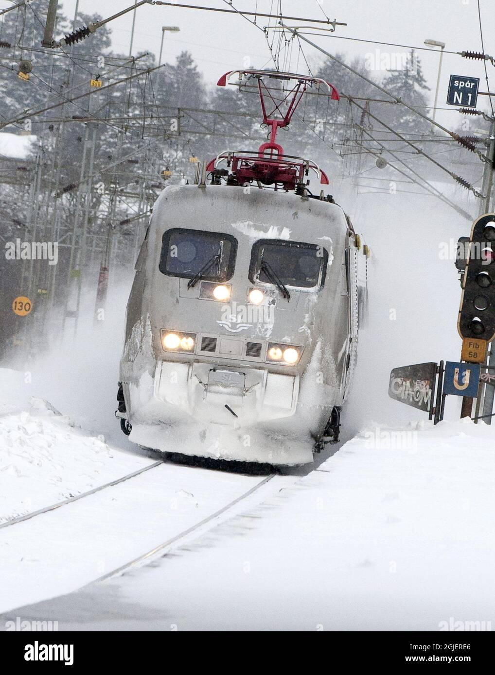 A X2000 high-speed train passing Flemingsberg station in winter Stock ...
