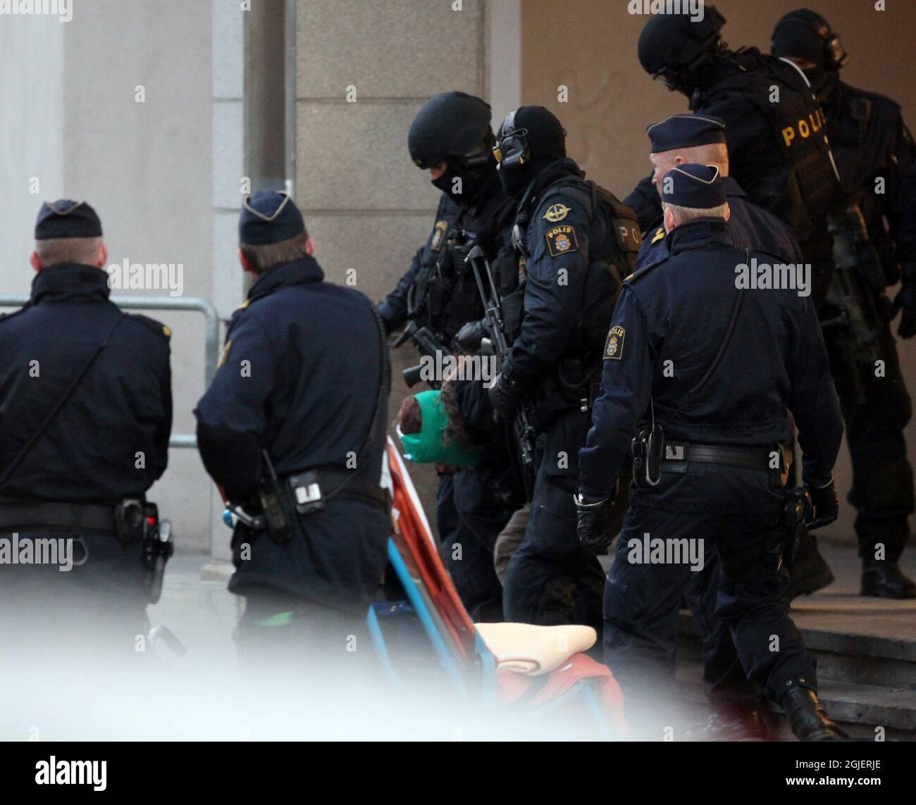 Police officers are seen arresting a man in Malmo, Sweden. The man ...
