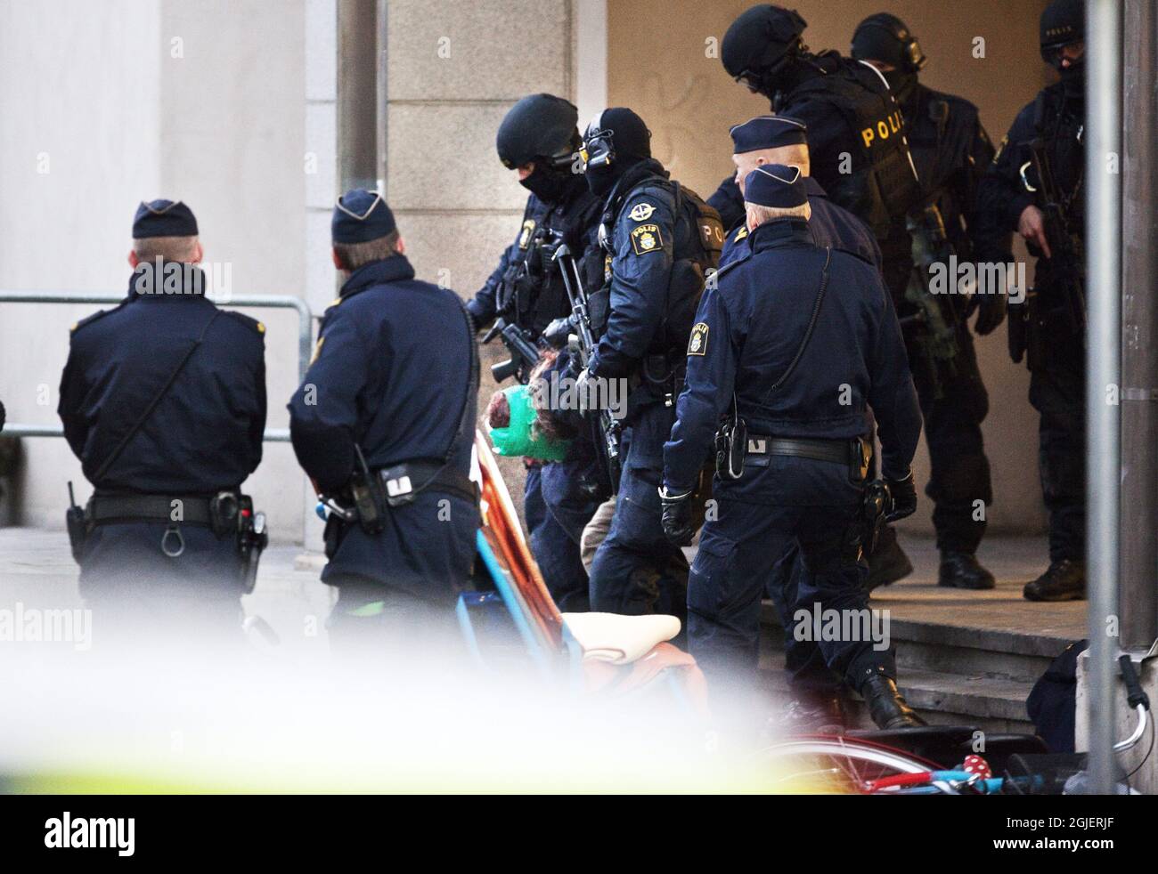 Police officers are seen arresting a man in Malmo, Sweden. The man ...
